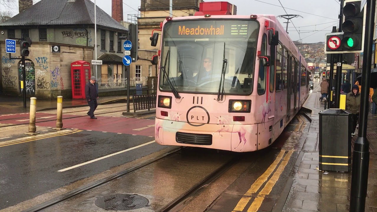 Stagecoach Supertram 111 departs a wet Hillsborough with a Yellow Route ...