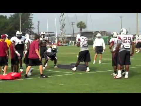 Ellis Johnson coaches his linebackers