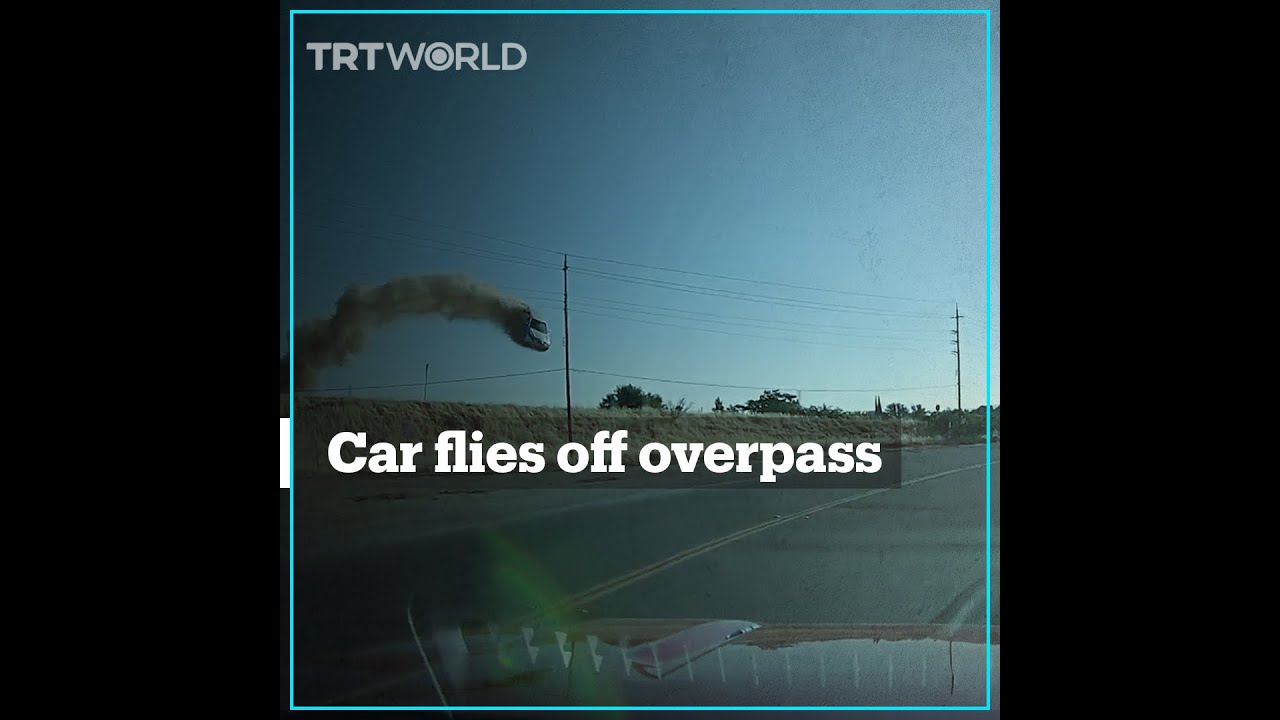 Car flies off overpass, crashing into oncoming traffic - YouTube