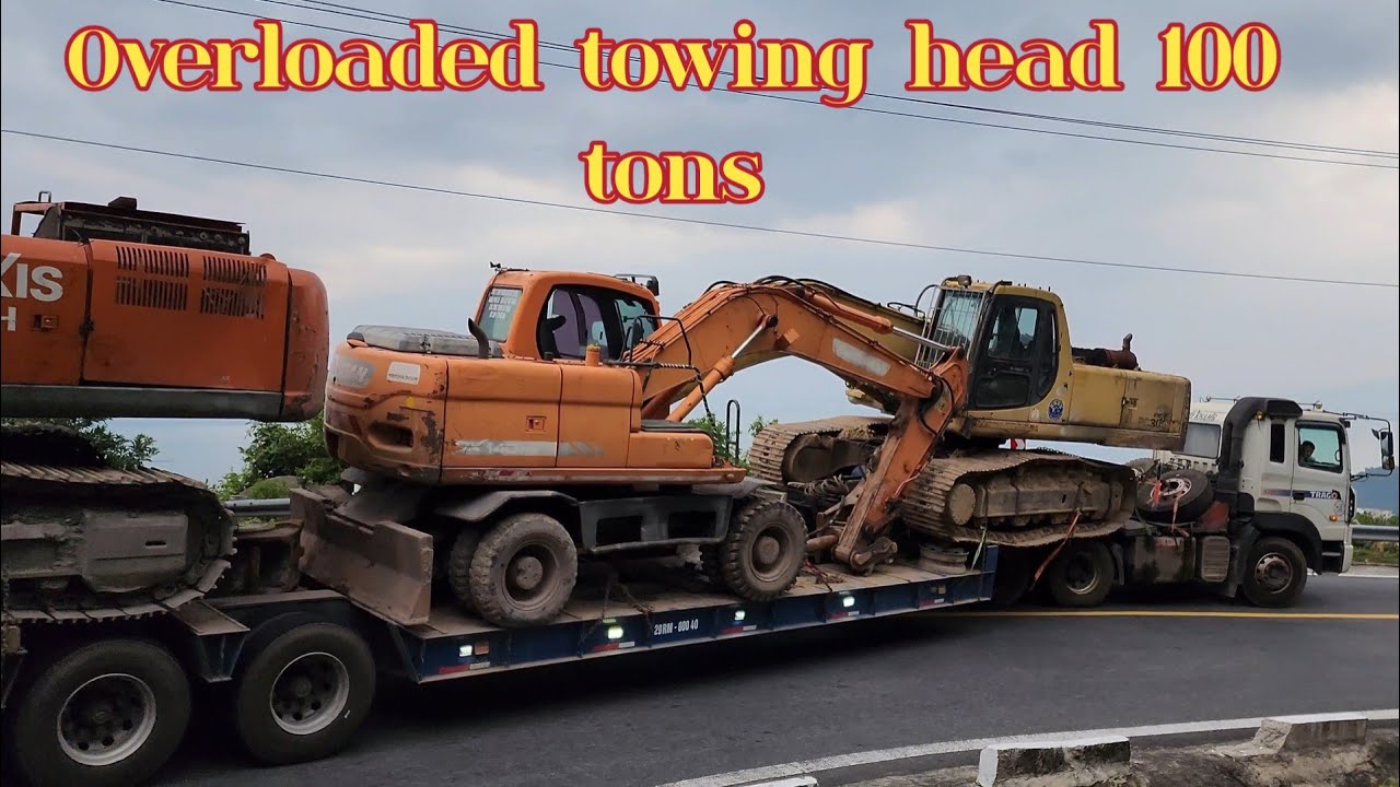 Korean tractor-trailer carrying 100 tons of cargo over dangerous slope ...
