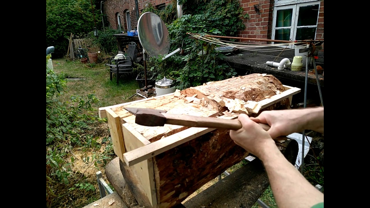 Medieval woodworking: Hewing a woodbeam with an axe - YouTube