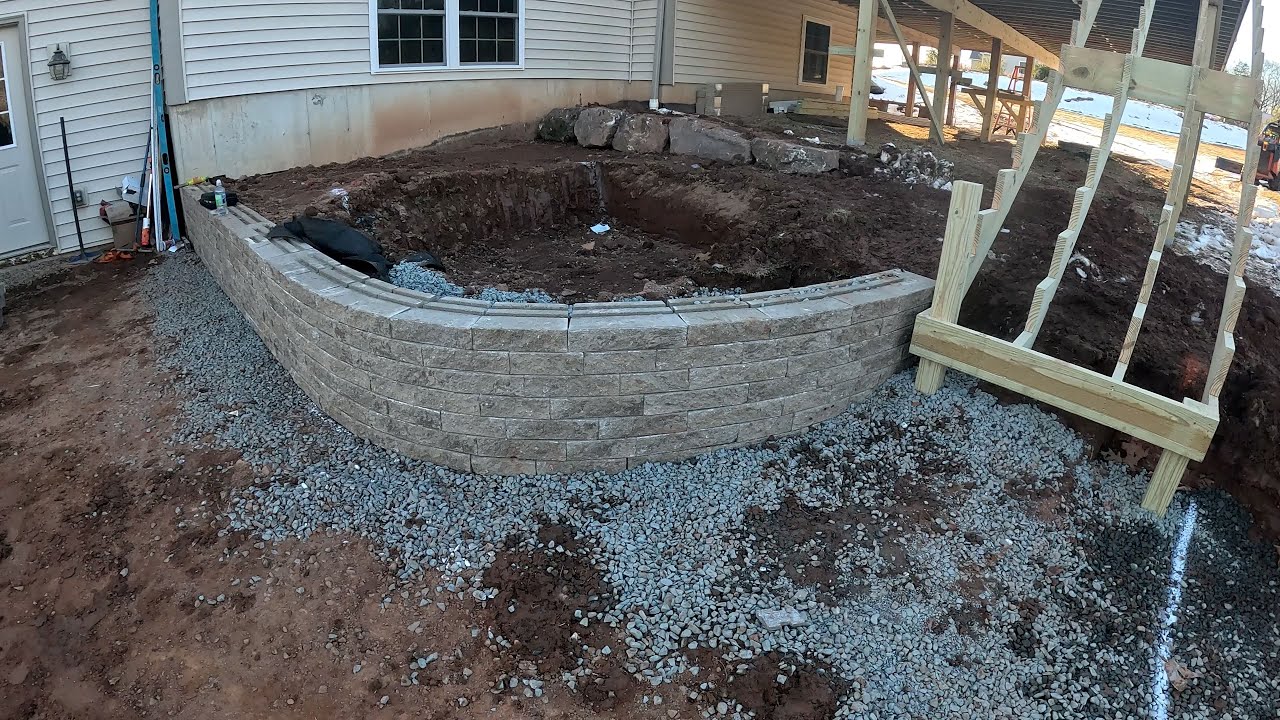 Hit a buried downspout. Making progress on the wall - YouTube