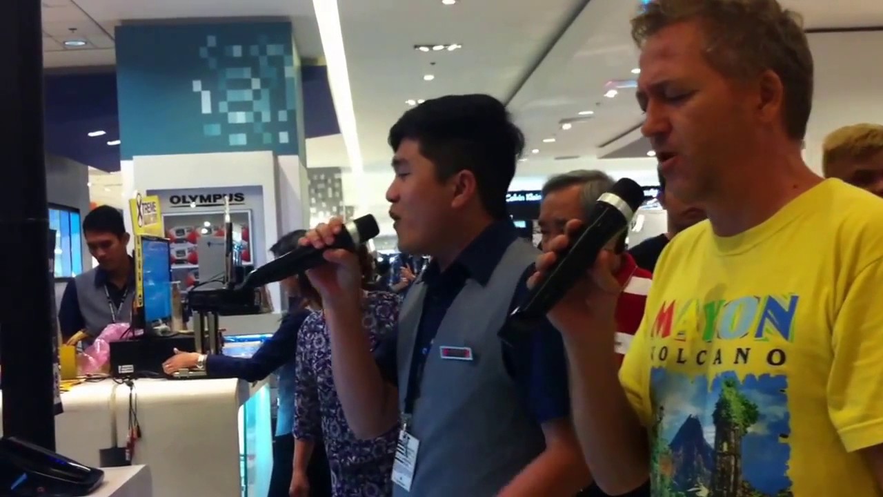 filipino sales man blows away crowd singing duet with american man ...