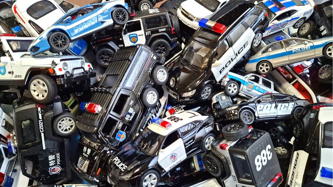 Large collection of model police cars taken out from the box one by one ...