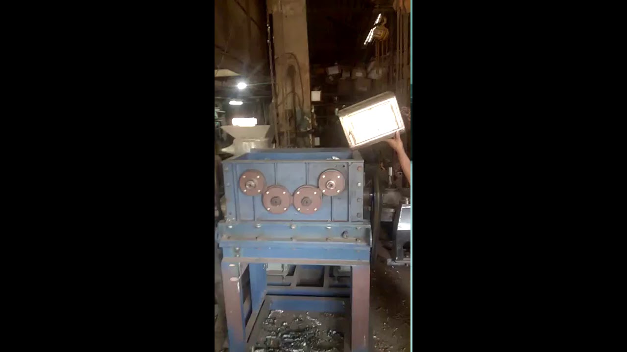 Metal Oil Can Shredding in a 4 Shaft Shredder - YouTube