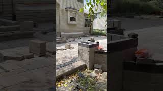 Installing a paver patio with walls and steps. #construction #outdoorliving #patio #pavers #unilock