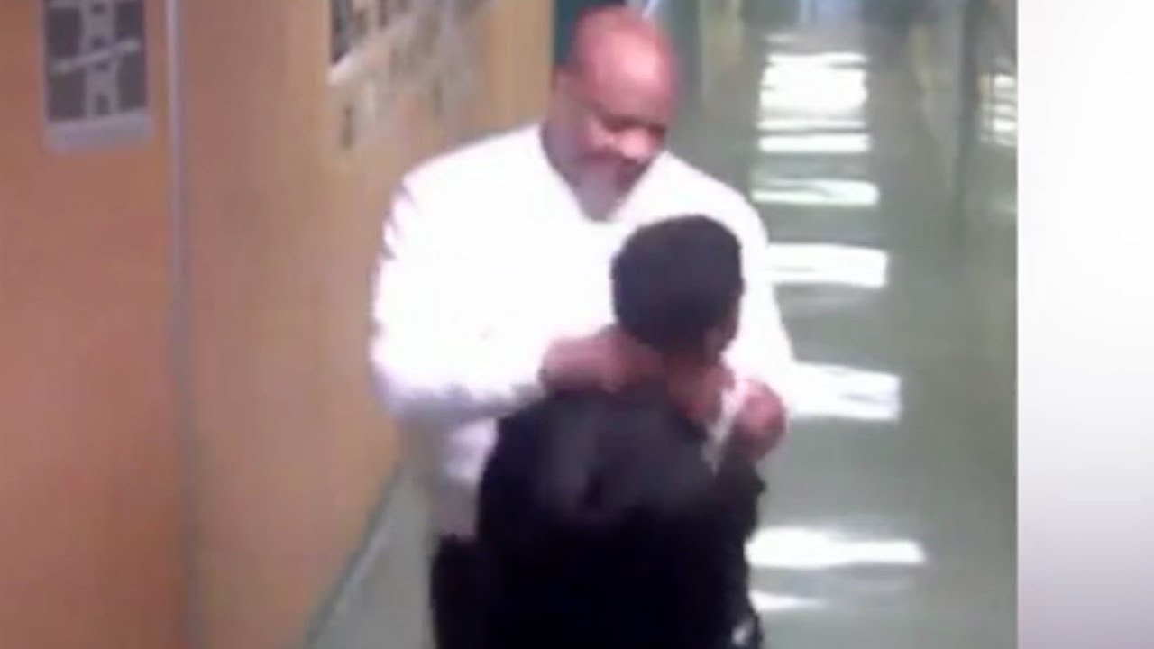 Video shows school employee lift student off ground by neck - YouTube
