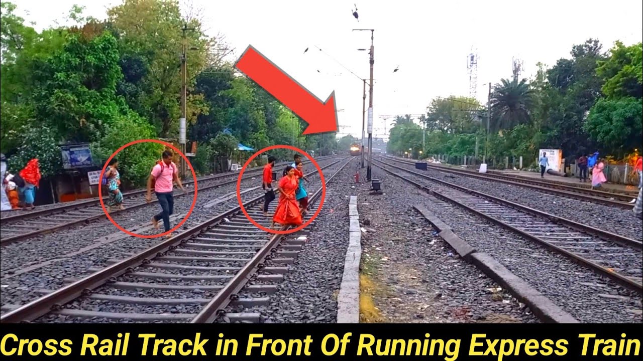 Rakelees People Cross Rail Track in Front Of Express Train...Very Risky ...