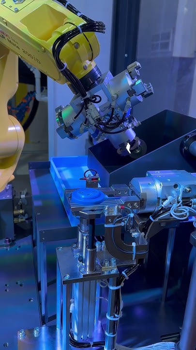 Fanuc Robot load parts from stocker to Machining Center then turn 180 degree to deburring ...