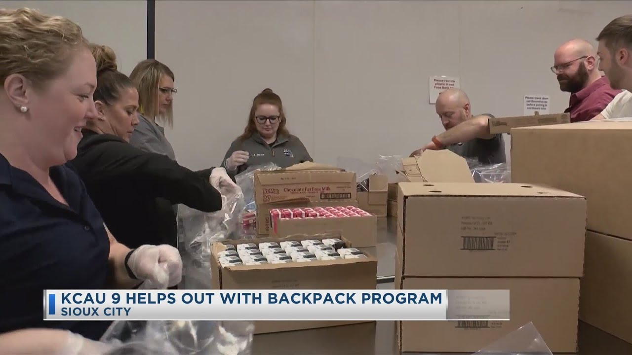 KCAU9 Staff Help Fill Backpacks at Food Bank - YouTube