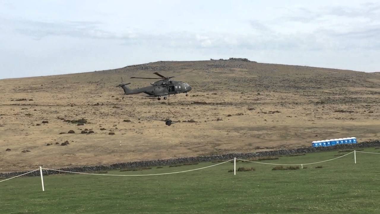 Low Flying Helicopter downdraft takes out Portaloo toilets - YouTube