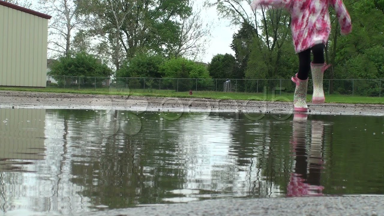Puddle Jumping - Little Girl Splashing Camera. Stock Footage - YouTube