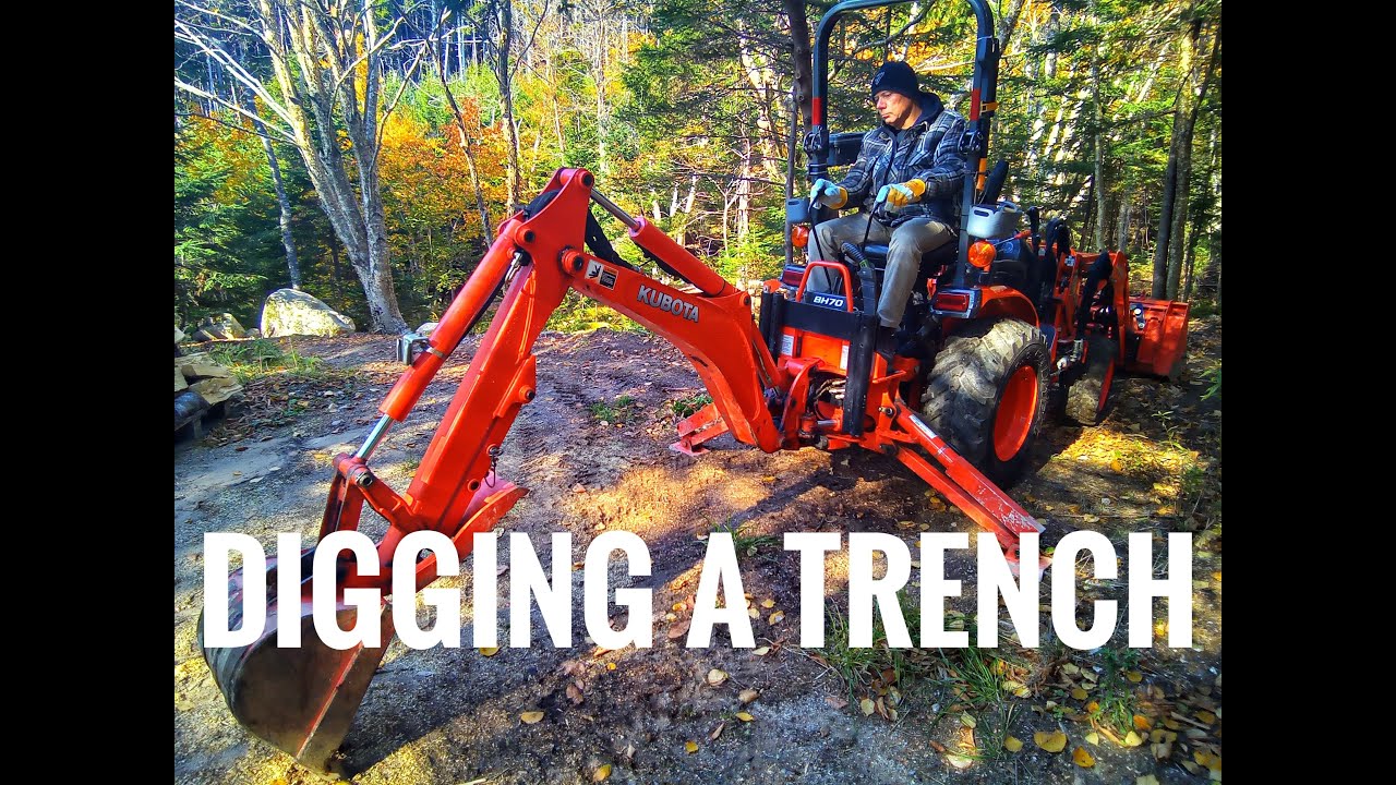 56. Backhoe Digging A Drainage Ditch And Installing A Drainage System ...