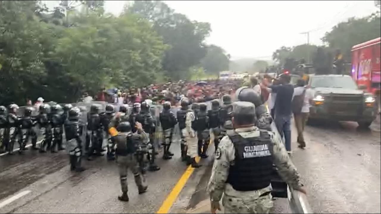 National Guard attempts to stop the caravan - YouTube
