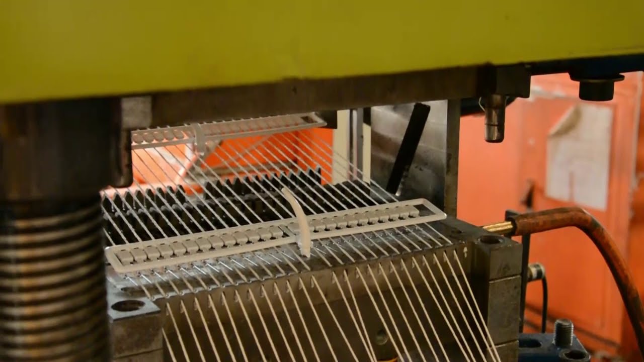 seal tag injection molding machine - YouTube