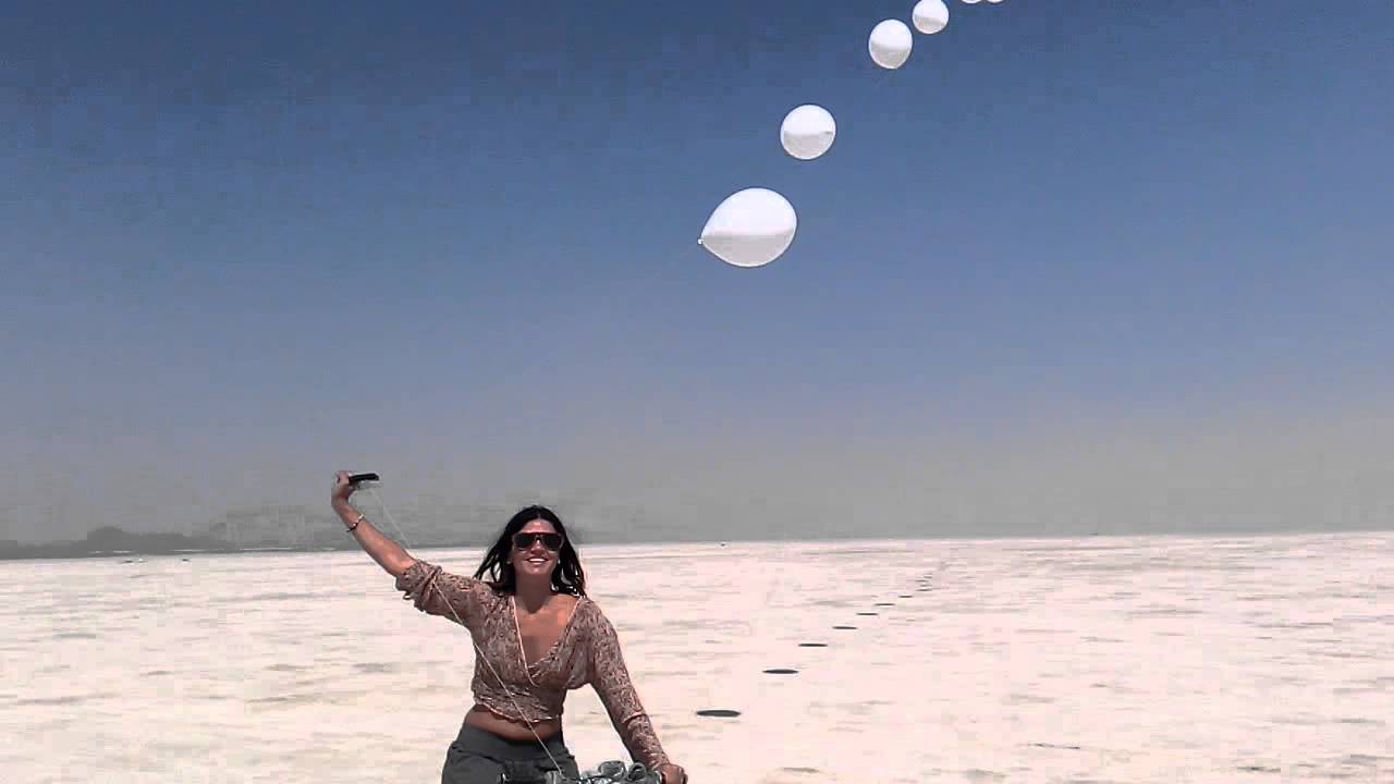 Stunning Burning Man Art Work Showpiece Balloon Chain in hands of ...