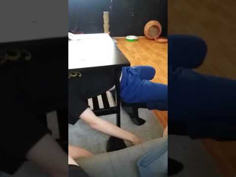 Little brother stuck under table