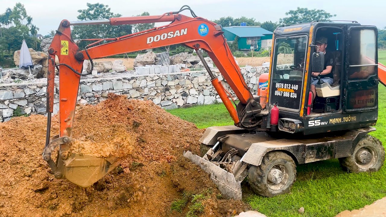 Wheel Loader Loading Soil and Digging Hole in Construction Site - JCB ...