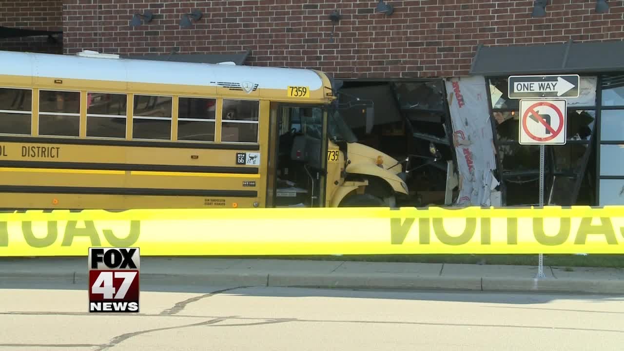 School bus driver runs light, crashes into building - YouTube