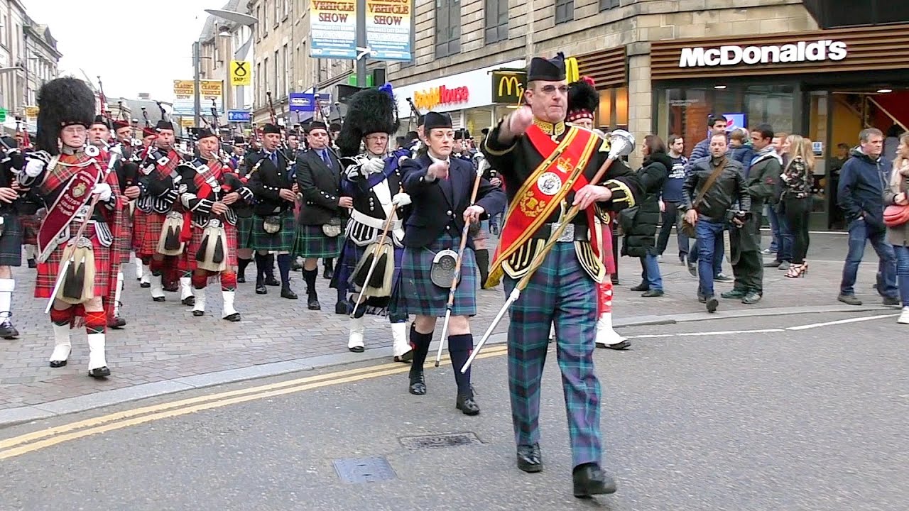 The Massed Highland Pipes & Drums marching through Inverness City ...