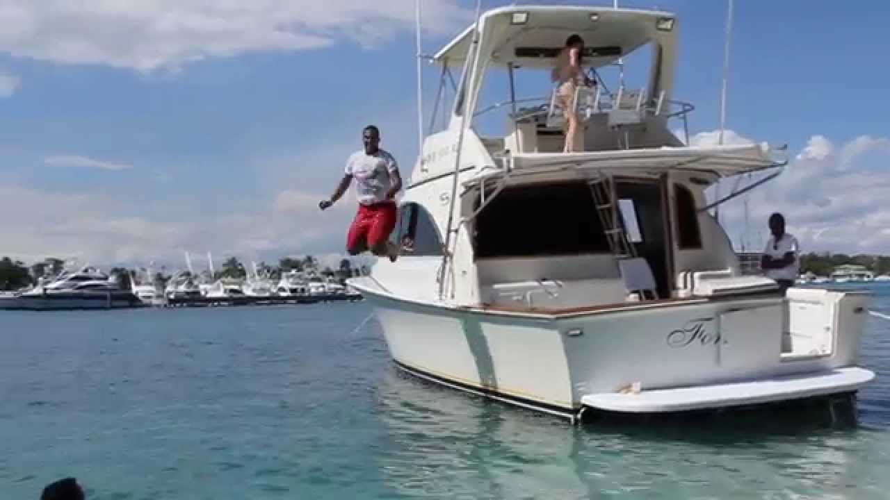 Big guy jumping in the water from the yacht. - YouTube
