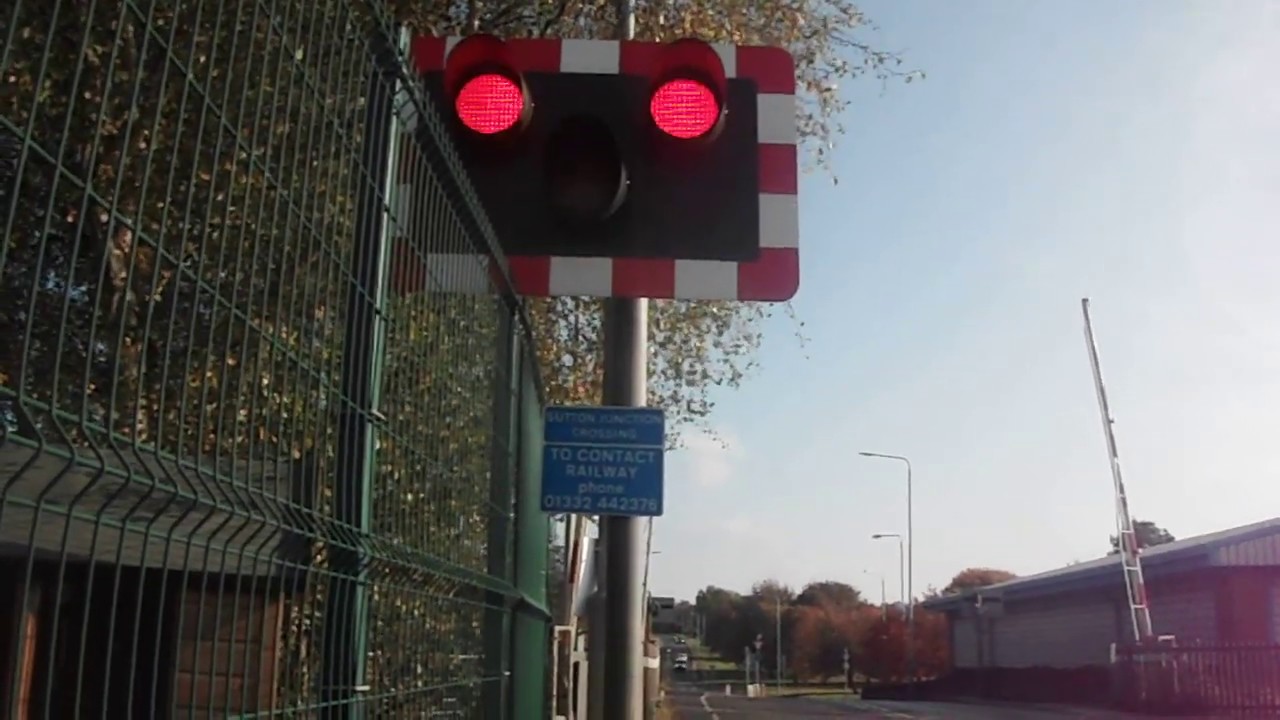 Sutton Junction level crossing - YouTube