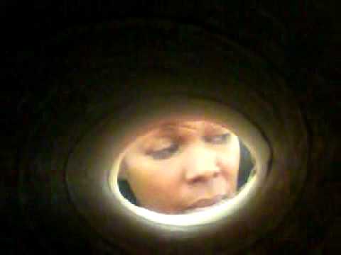 Peeping through a peep hole with Both eyes.
