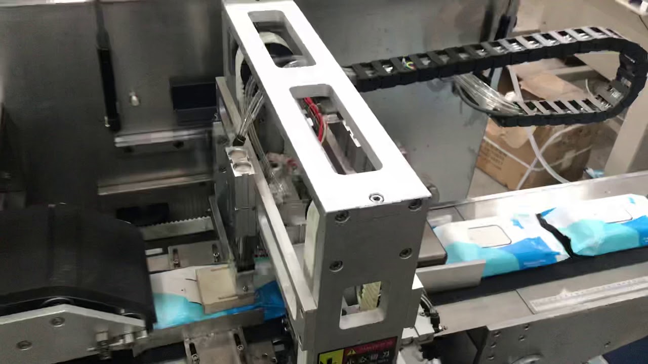 Hy-5800B Full auto Lid applicator for wet wipes , wet wipes lid machine. - YouTube