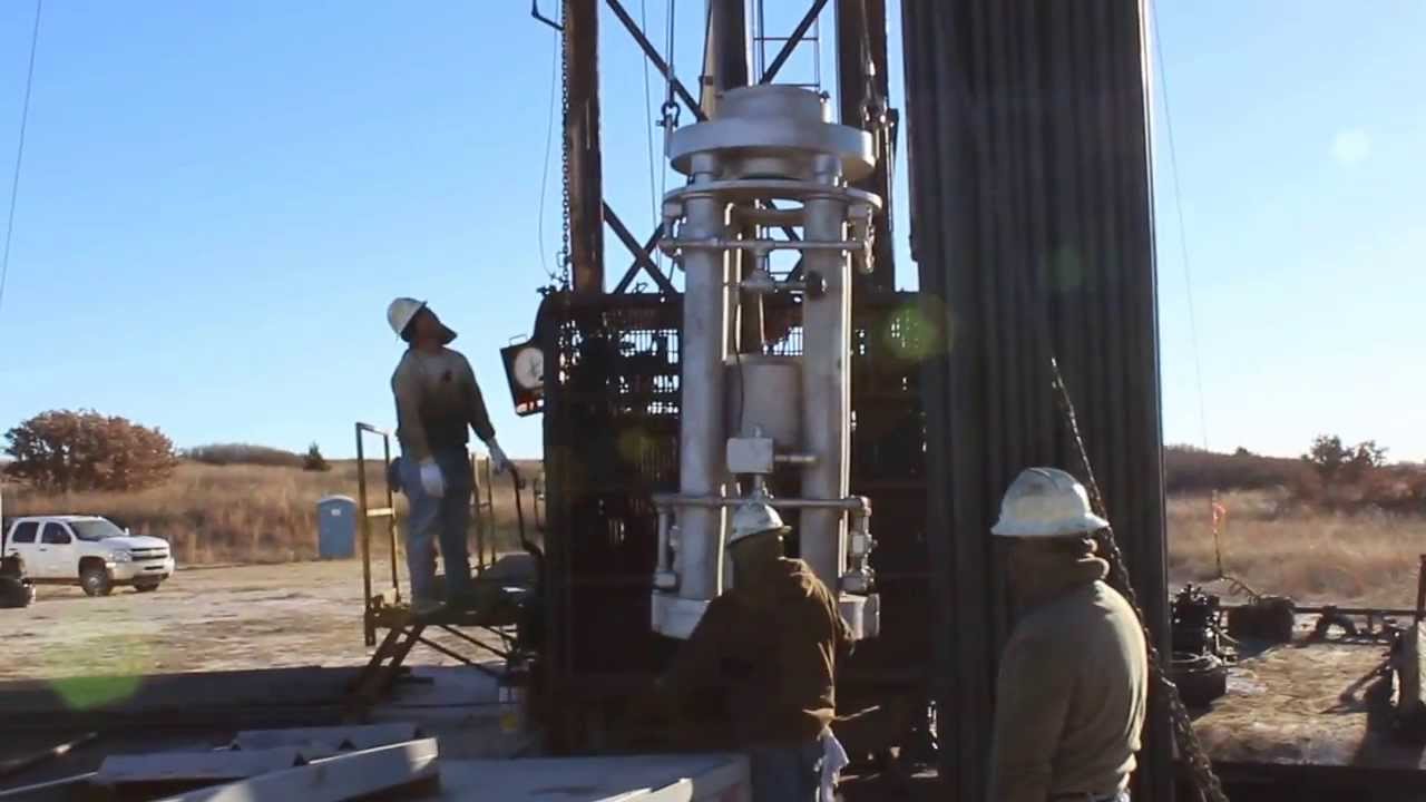 Casinjac 282 casing jack being set on well head. - YouTube