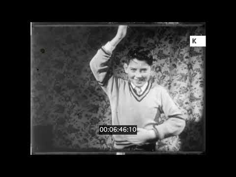 1950s UK, Boy Rubs Head and Pats Tummy, 16mm