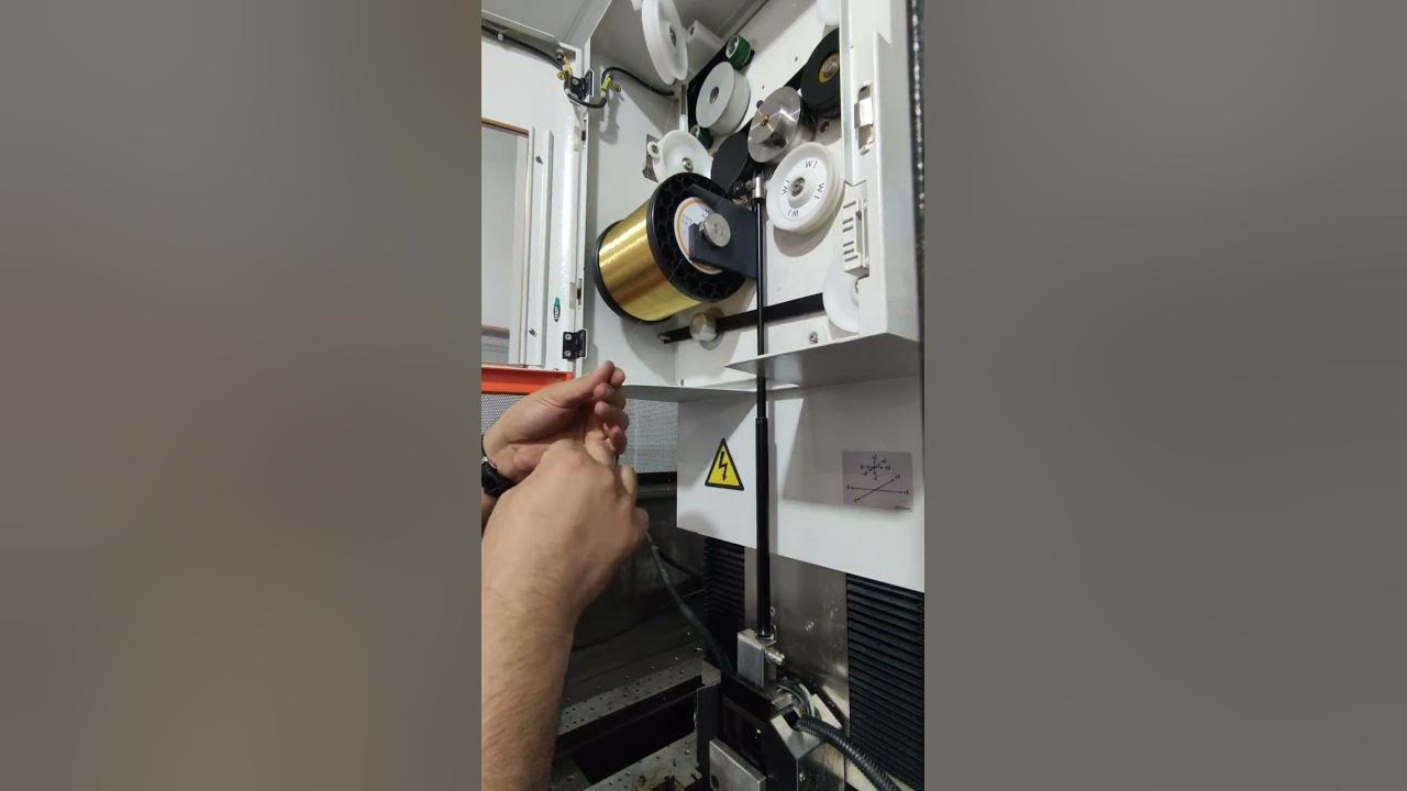 EDM wire machine wire installation in the machine - YouTube