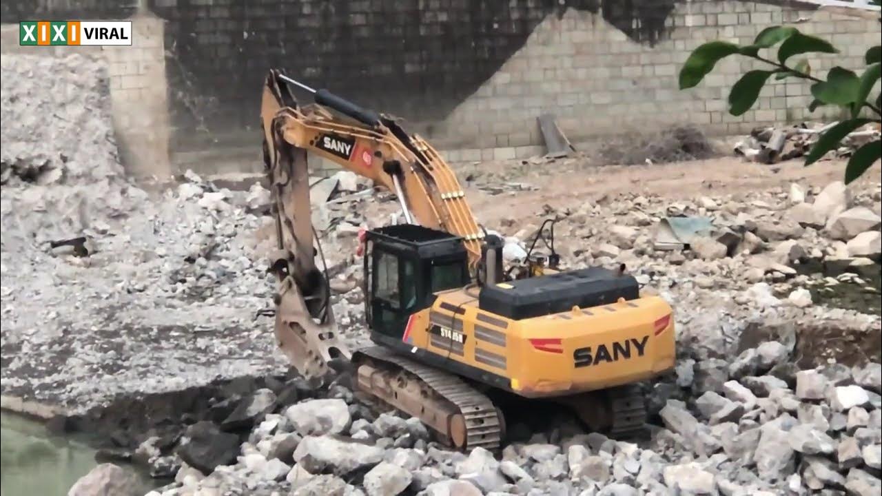 SANY excavator breaks concrete under dry riverbed, Kubota excavator ...