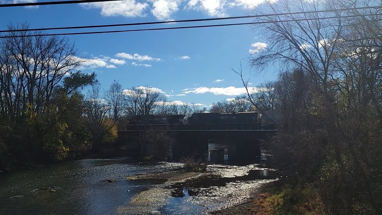 an eastbound manifest crossing the Elkhart river in Goshen - YouTube