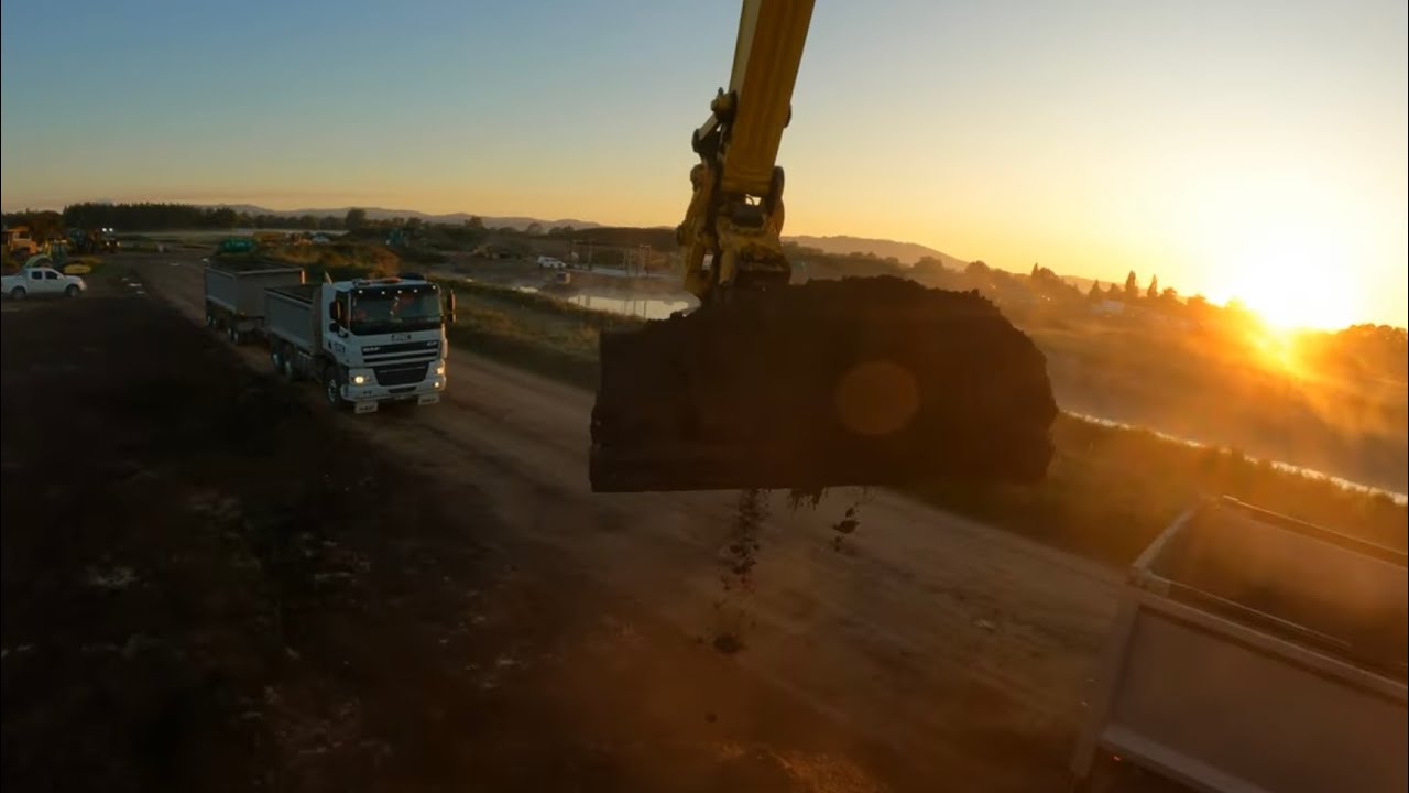 RAW sounds of a DIGGER loading trucks on Sunrise - YouTube