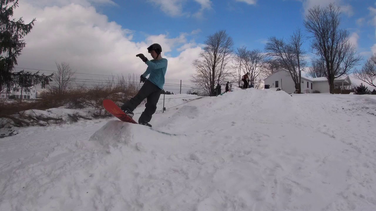 Backyard snowboard rope lift sends - YouTube