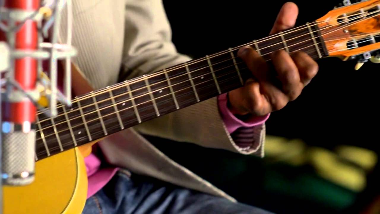 Eric Bibb plays a Lottonen Model P-12 12-string Parlor guitar ...