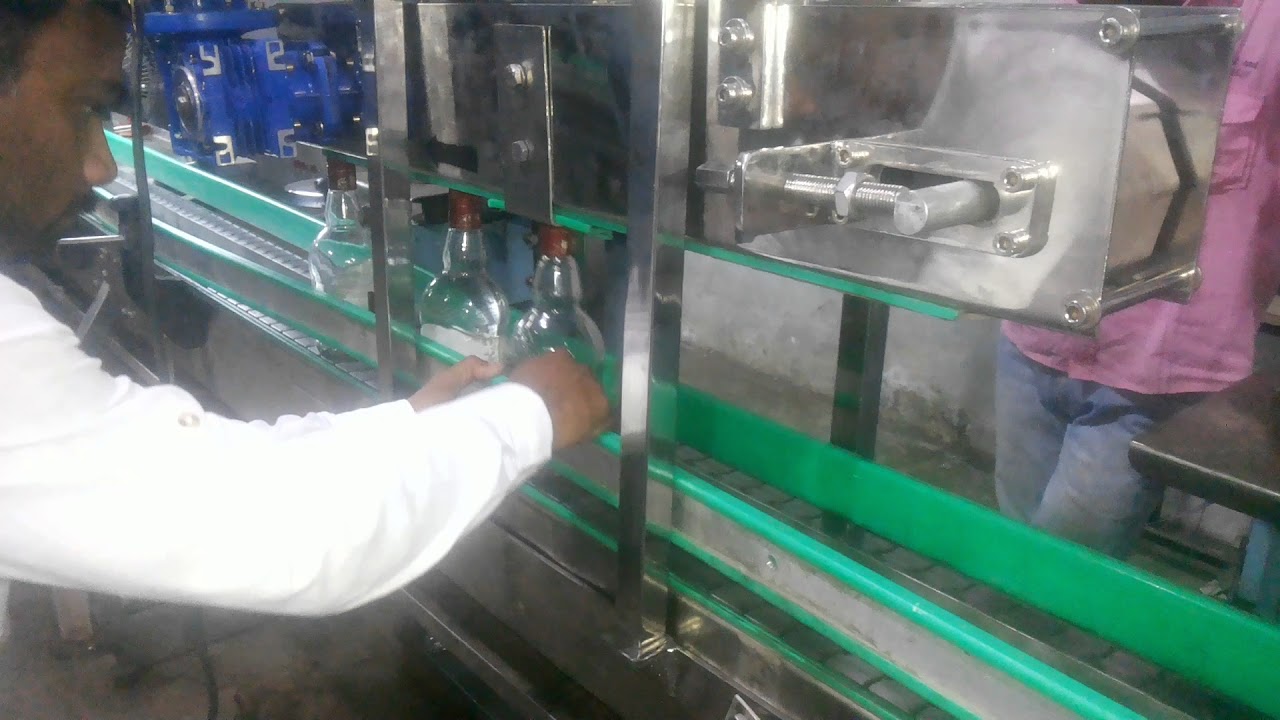 Guala cap sealing machine - YouTube