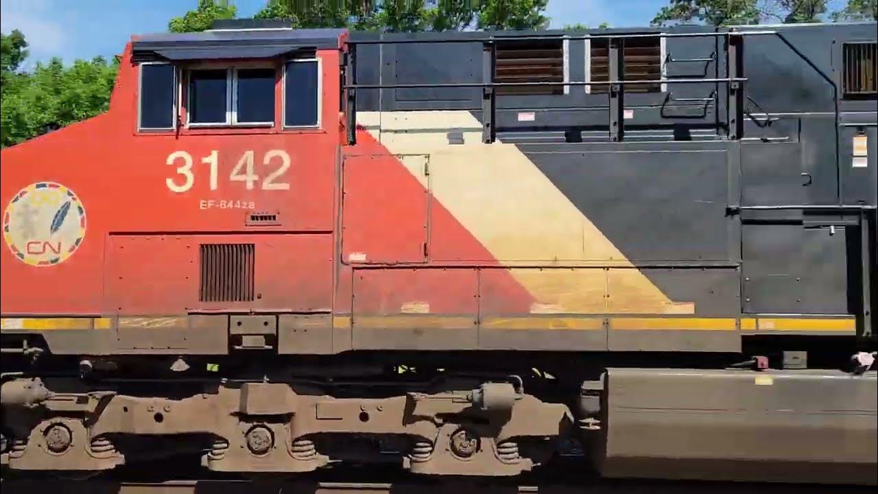 CN 3142, 3943 Westbound freight train with BNSF steel coil car at Vicksburg, MI - YouTube