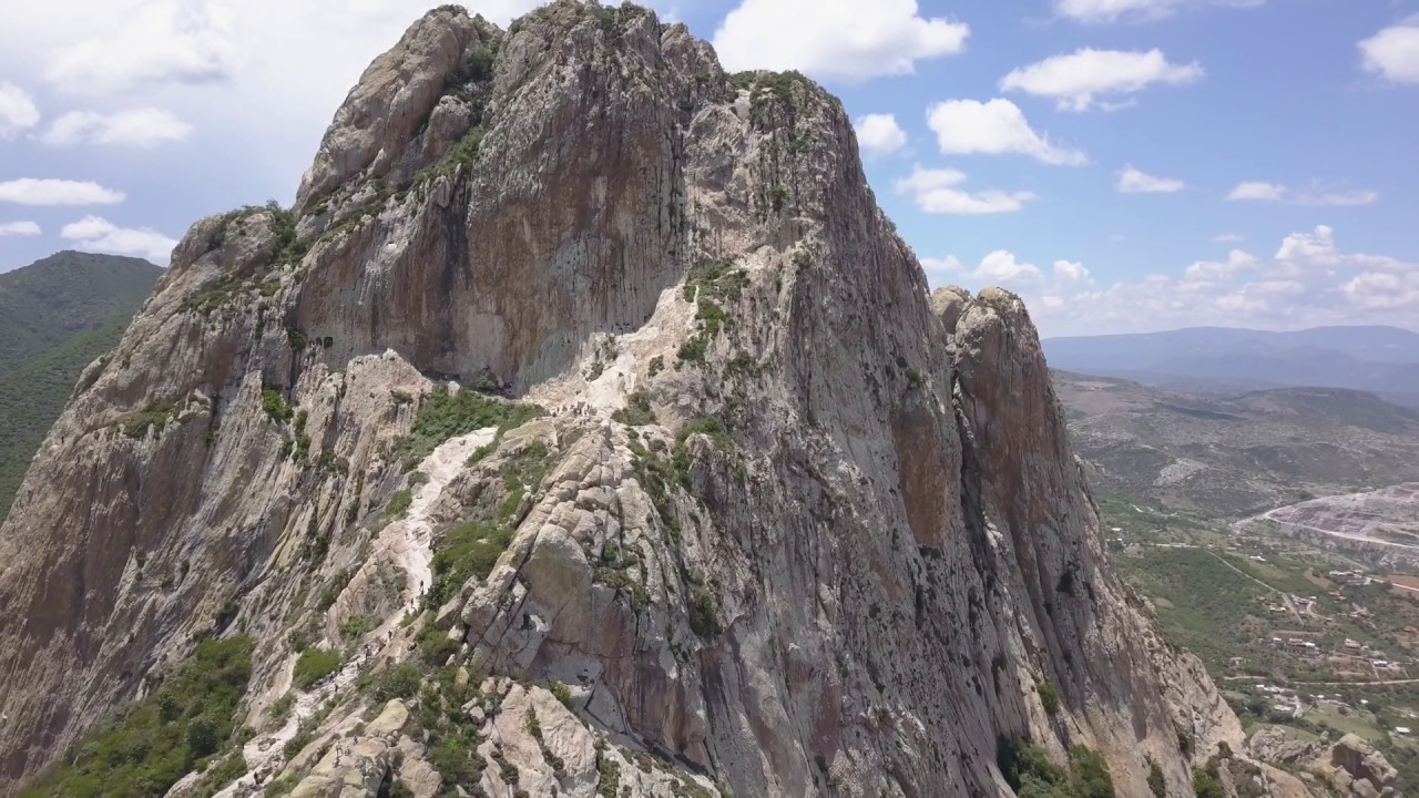 My areal drone footage of a stunning monolith in Peña de Bernal, Mexico ...