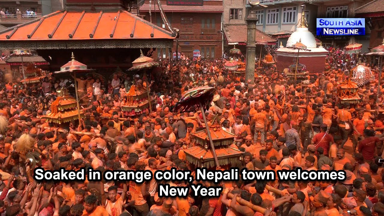 Soaked in orange color, Nepali town welcomes New Year - YouTube