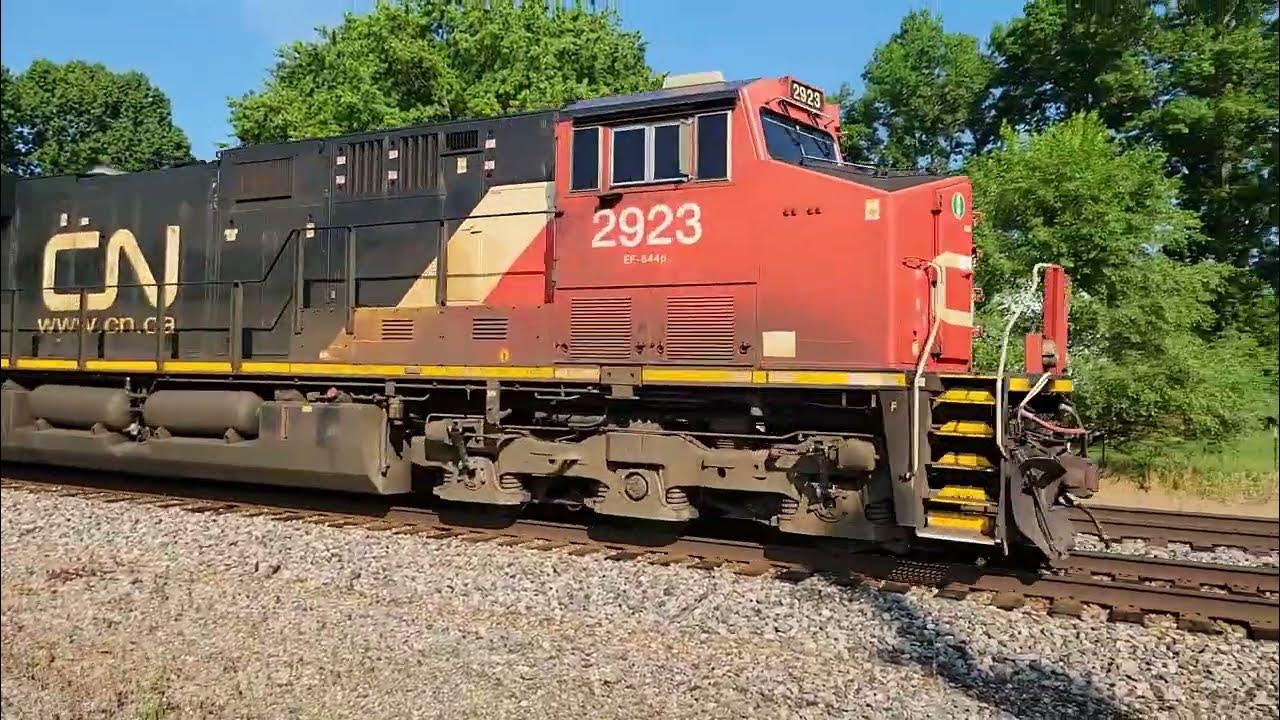 CN 2953, 2928 motor an Eastbound freight train with BN, BNSF covered hoppers past Vicksburg, MI ...