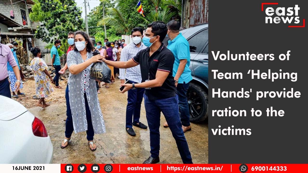 Volunteers of Team ‘Helping Hands' provide ration to the flood victims ...