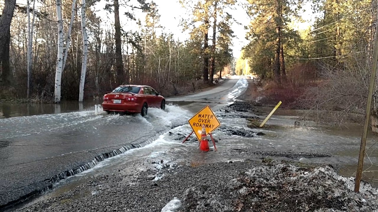 Flood water over roadway! - YouTube