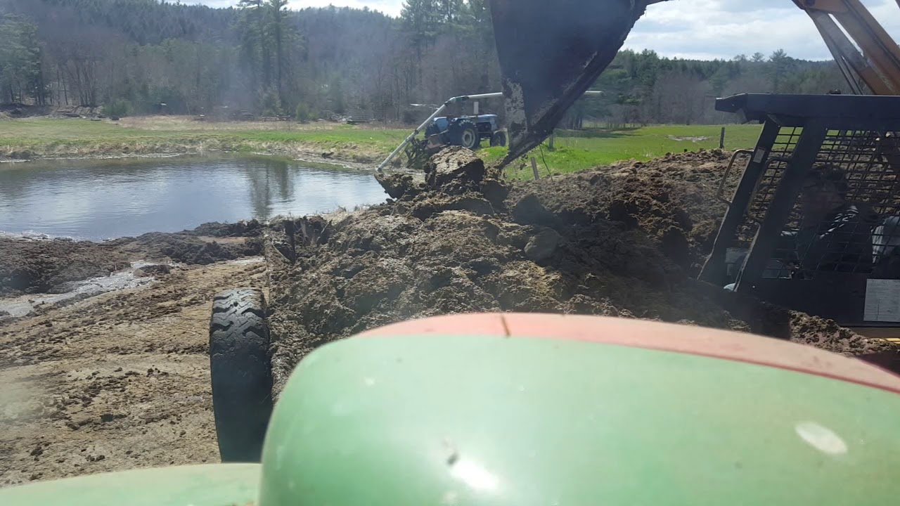 Loading cow manure - YouTube