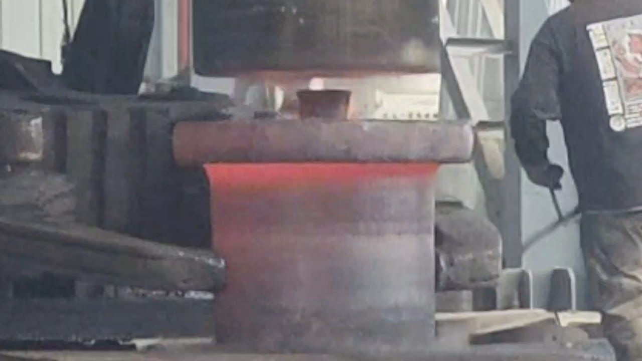 GIANT HEAVY-DUTY EQUIPMENT in Forging Plant - Iron post forging ring ...