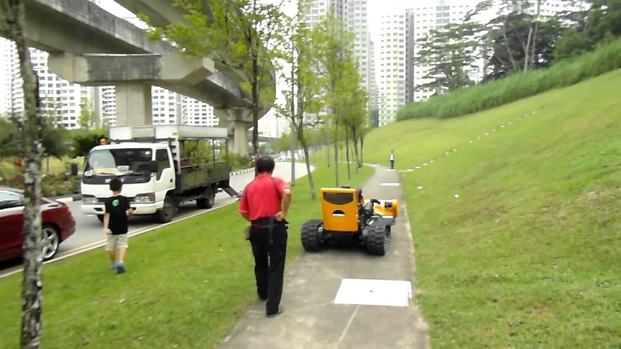 Ho Eng Huat Construction - Mcconnel Robocut Slope mowing - YouTube