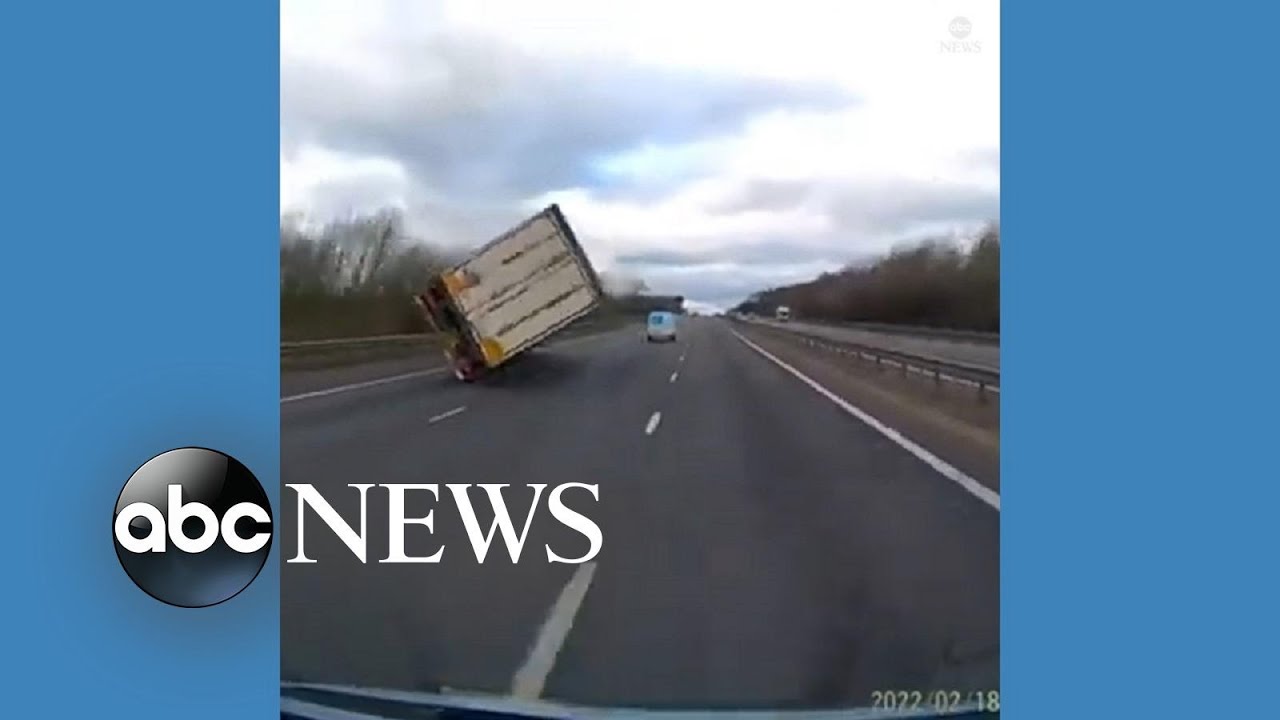 Powerful winds knock over truck on road - YouTube