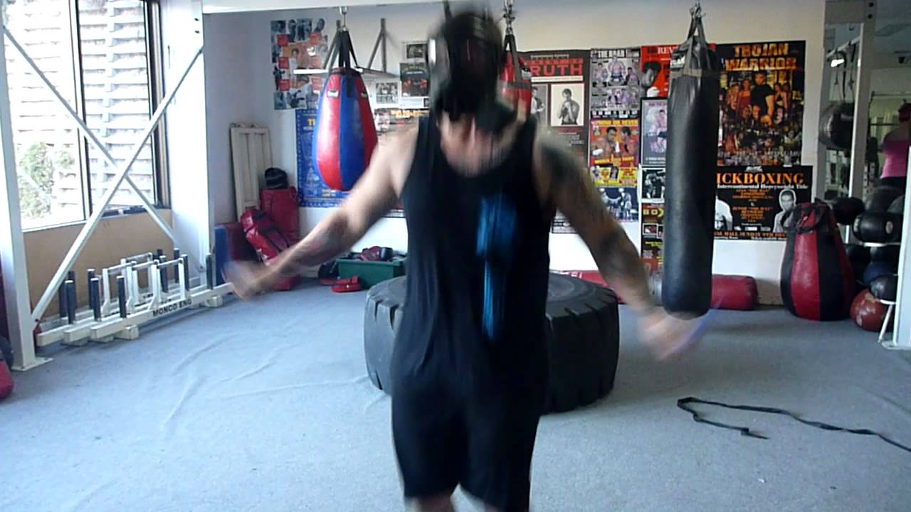 Strongman conditioning skipping in gas mask - YouTube