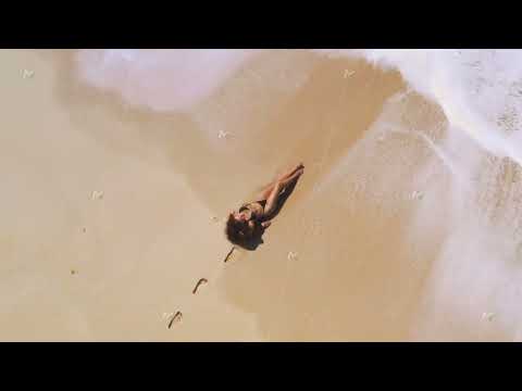 Aerial Drone View of Bikini Woman on Tropical Beach with Calm Waves