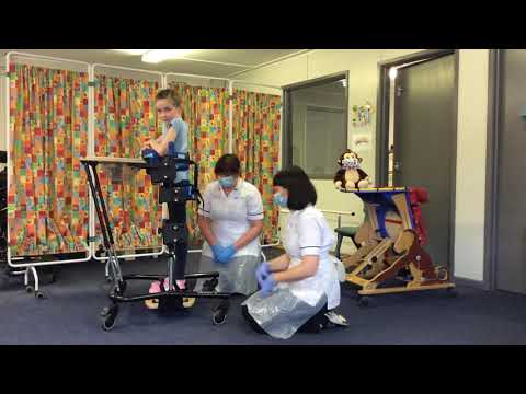 Transferring a child out of an Upright Standing frame to stand - YouTube
